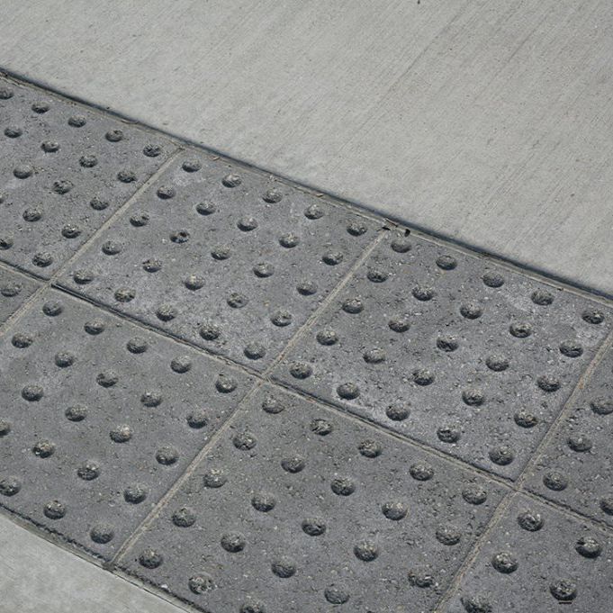 Engineered stone paver - ADA™ - UNILOCK - outdoor / textured / pedestrian