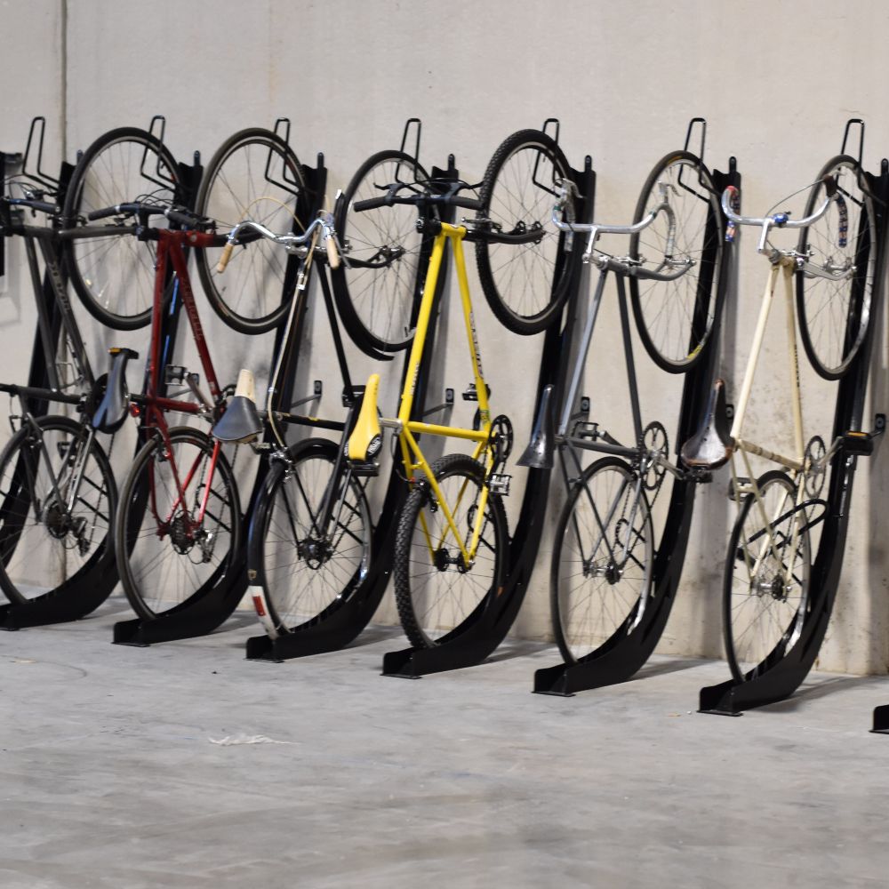 Wall-mounted bike rack - ROLL UP - Madrax - vertical / garage ...