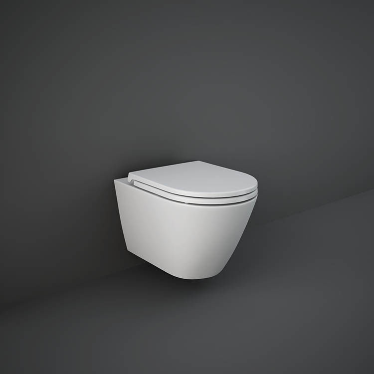 Wall-hung toilet - RAK-FEELING - RAK Ceramics - ceramic / oval / rimless