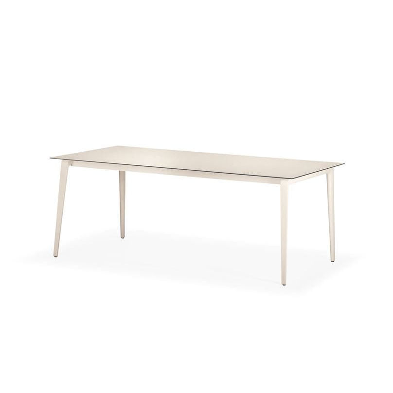 Contemporary dining table - WA - DEDON GmbH - HPL / cast aluminum base ...