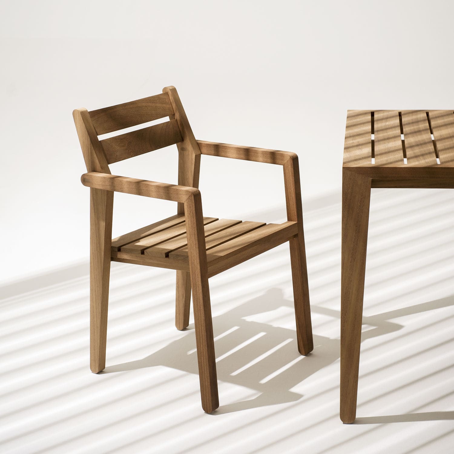 Contemporary garden chair - ZANIA 001 - RODA - outdoor / iroko / stackable