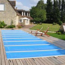 Swimming pool cover with rods - Mondial Piscines - security / winter ...