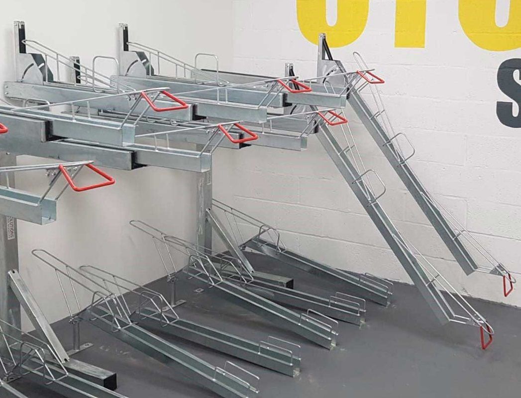 Floor-mounted bike rack - ALOES RED - metal / double-decker / commercial