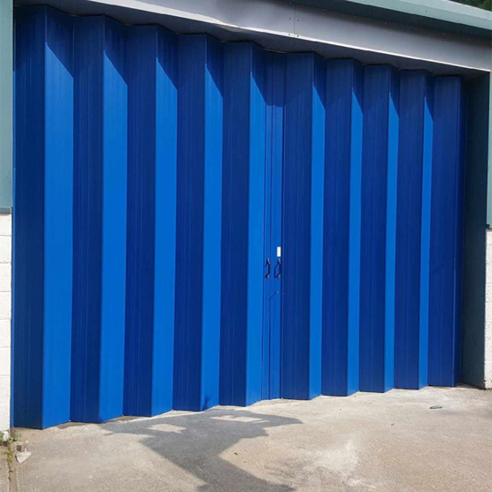 Industrial folding door - dormakaba - steel / electric / for warehouse