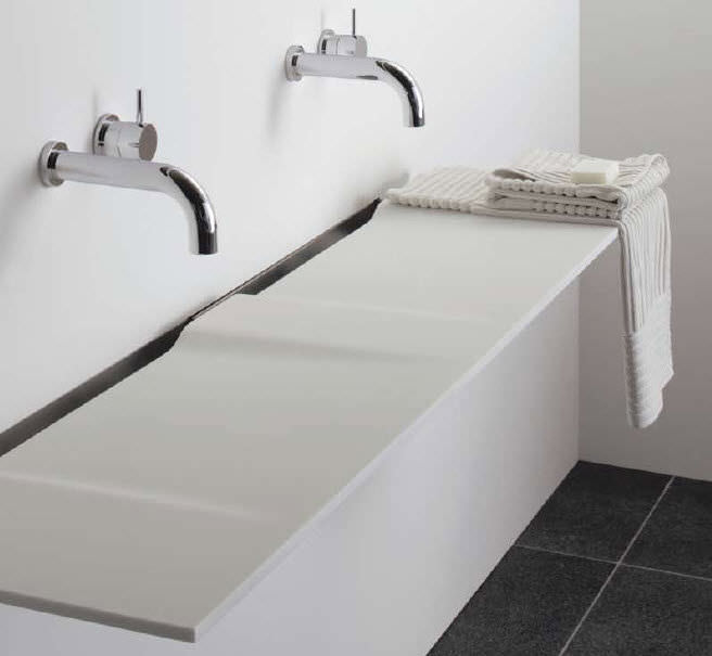 Wall-mounted washbasin - LINEA - Omvivo - Solid Surface / with counter ...