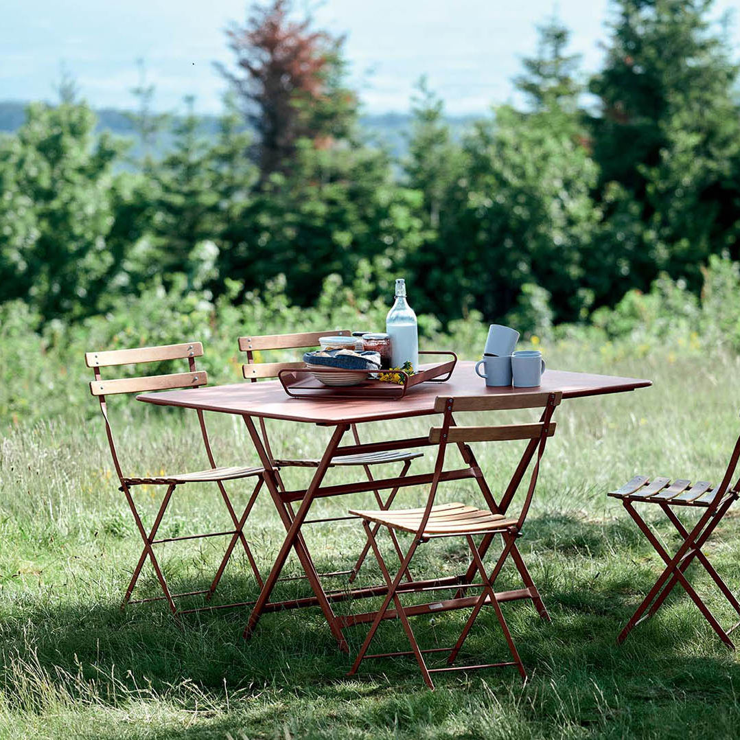 Contemporary table - CARACTÈRE - FERMOB - sheet steel / steel base ...