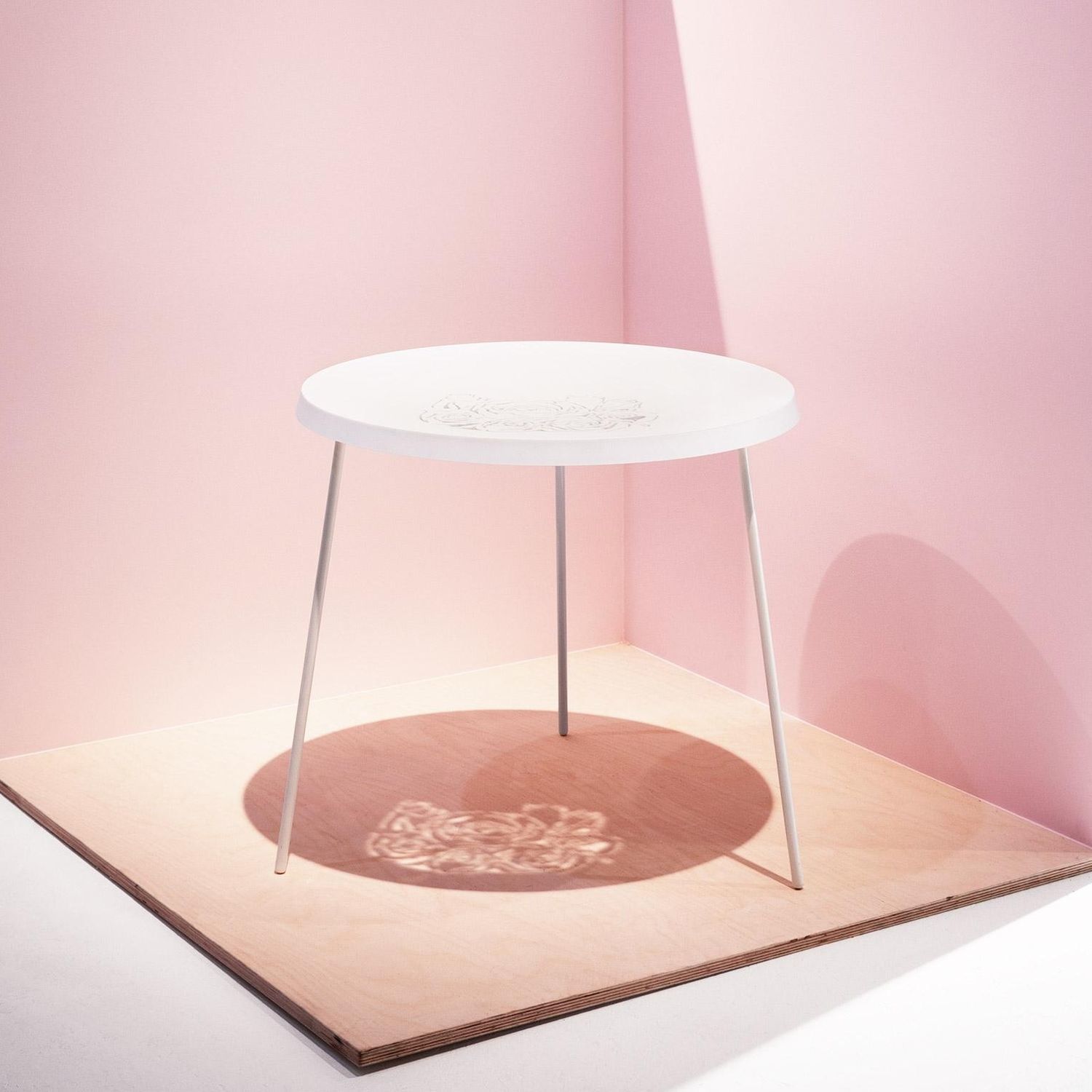 Contemporary side table - float - bruehl - Corian® / Corian® base / round