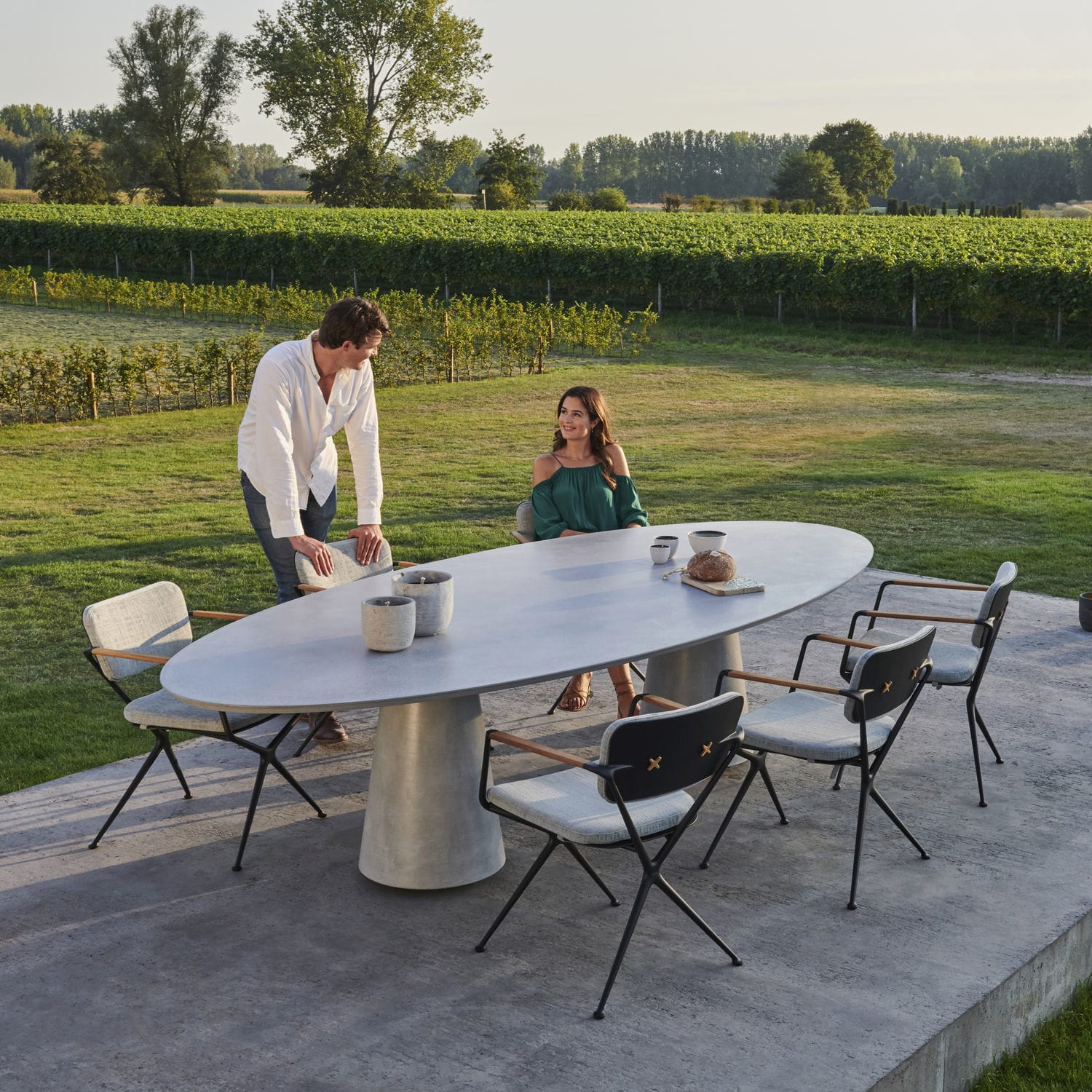 Contemporary dining table - CONIX - Royal Botania - teak / ceramic / concrete