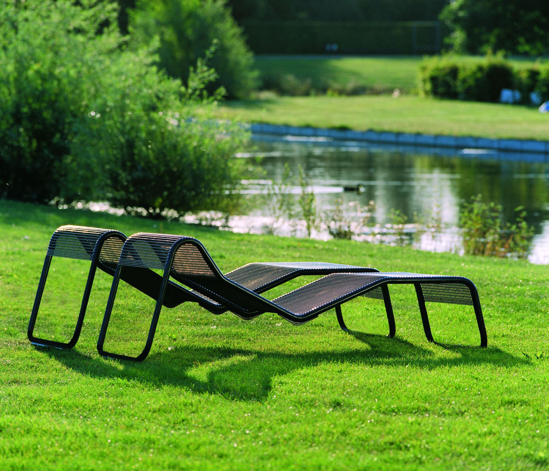 Contemporary sun lounger - TIVOLI - ERLAU - mesh / steel / for public space