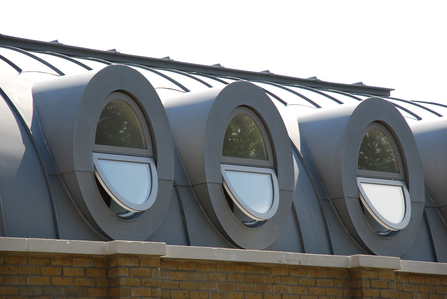 Arched Dormers With Standing Seams