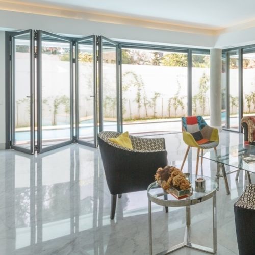 Folding patio door - 4700 - Sepalumic - aluminum / double-glazed / 3 leaves