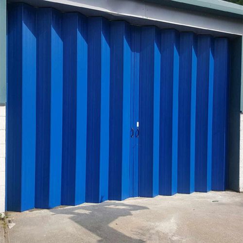 Industrial folding door - dormakaba - steel / electric / for warehouse