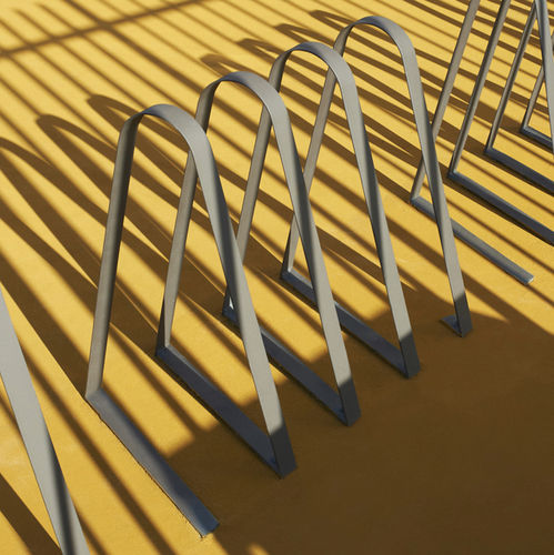 Floor-mounted bike rack - TRIÂNGULO - LARUS DESIGN - steel / commercial ...