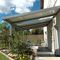 Self-supporting pergola - Confort - HEOLIAN - wall-mounted / metal / glass